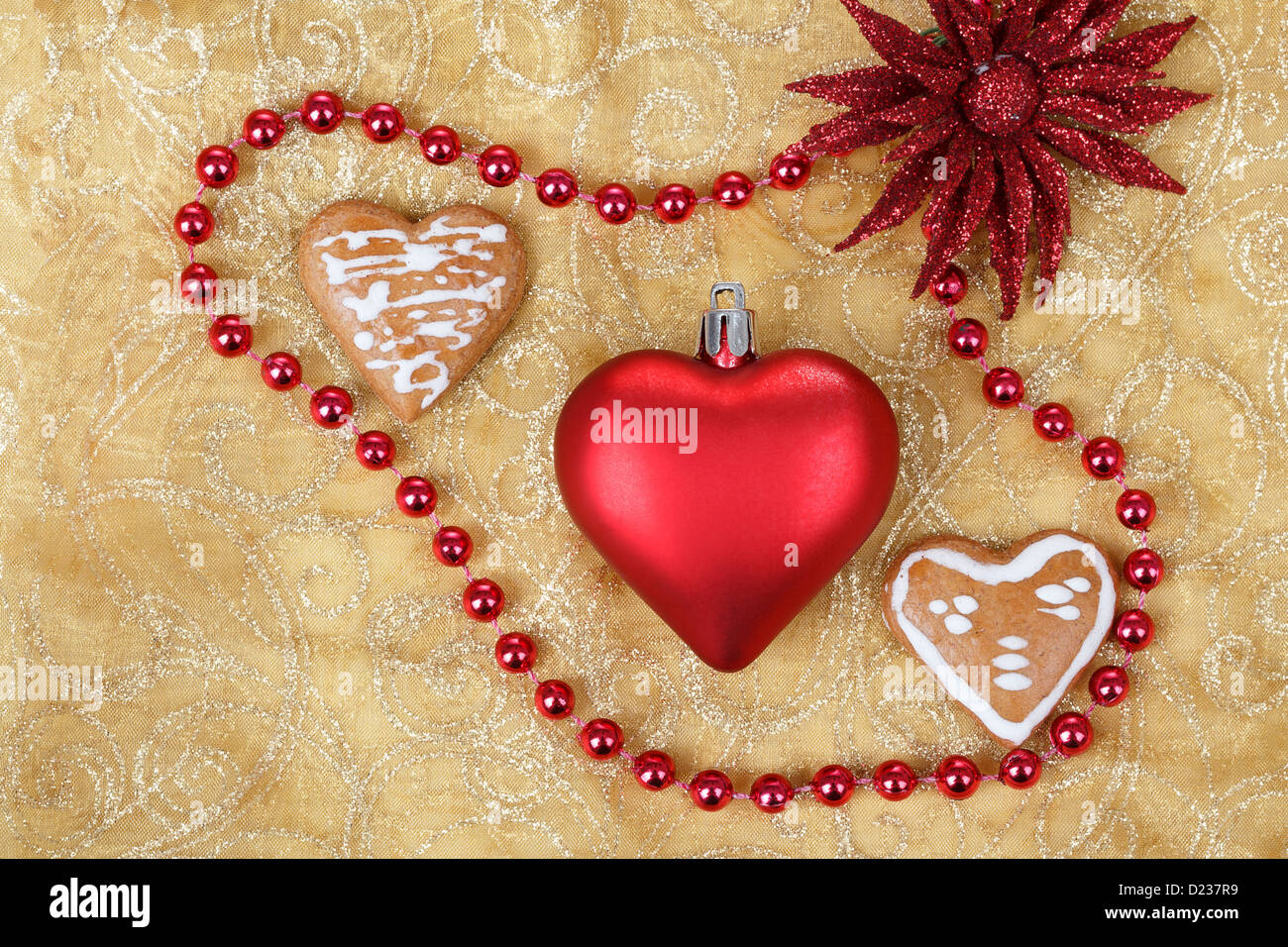 red heart with jewelery and gingerbread on christmas table cloth Stock ...