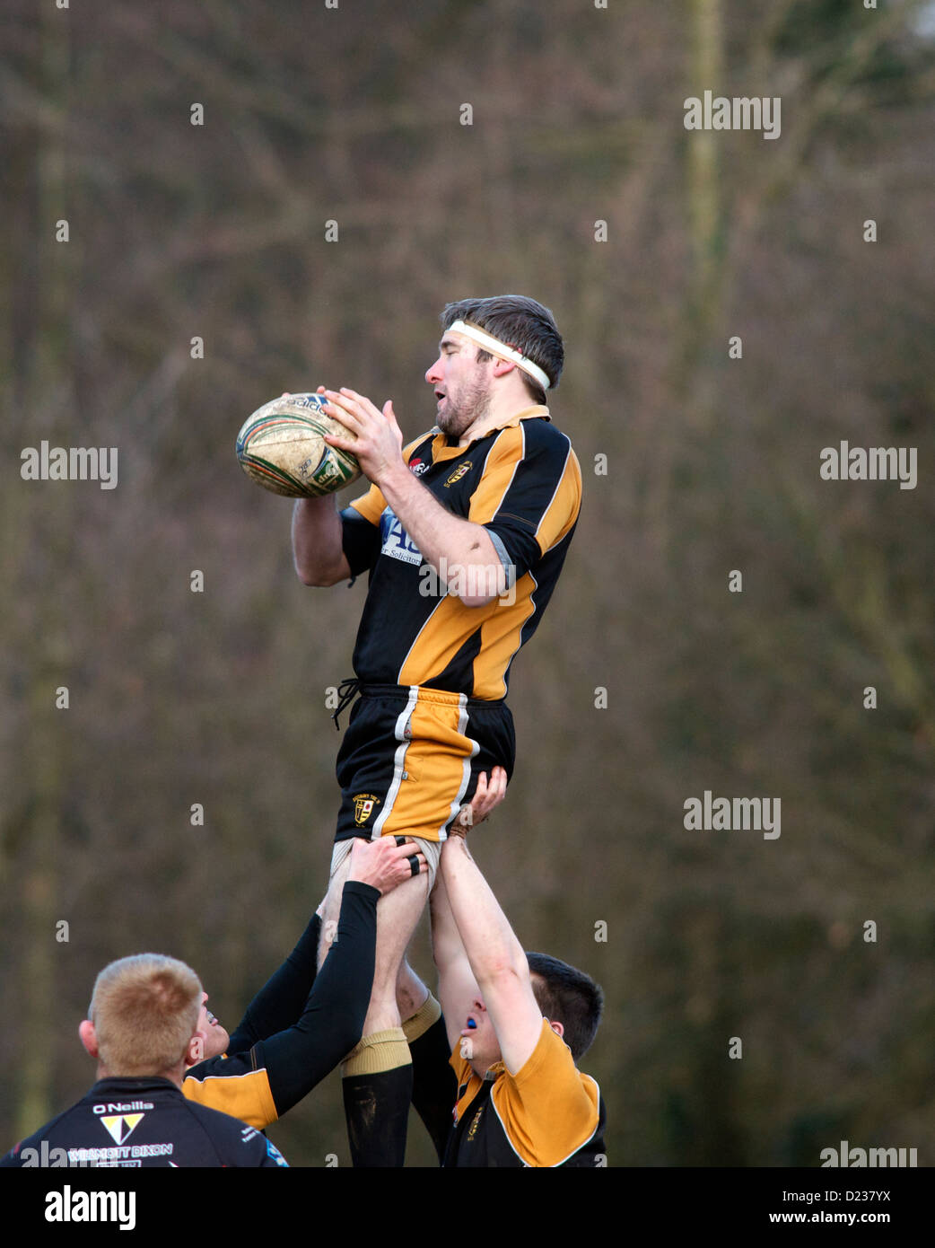 rugby player catches the ball at a line-out during an amateur rugby ...