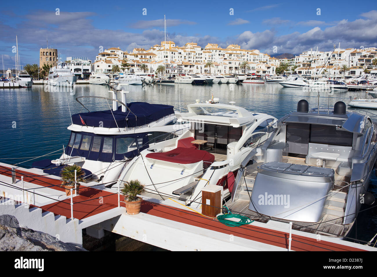 Marina with luxury yachts in resort town of Puerto Banus on Costa del ...