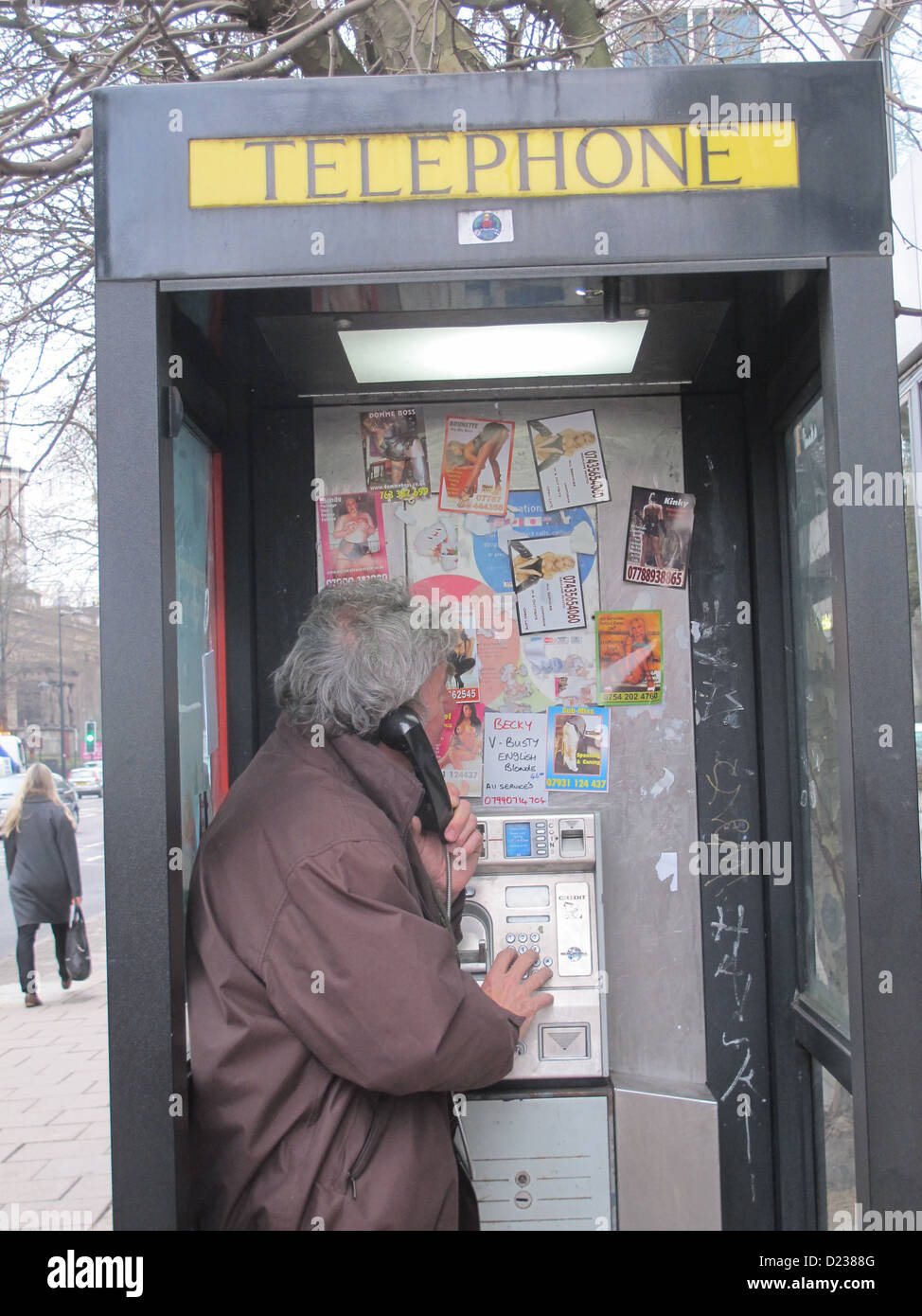 England London Kings Cross Telephone box with illegal flyers pasted to ...
