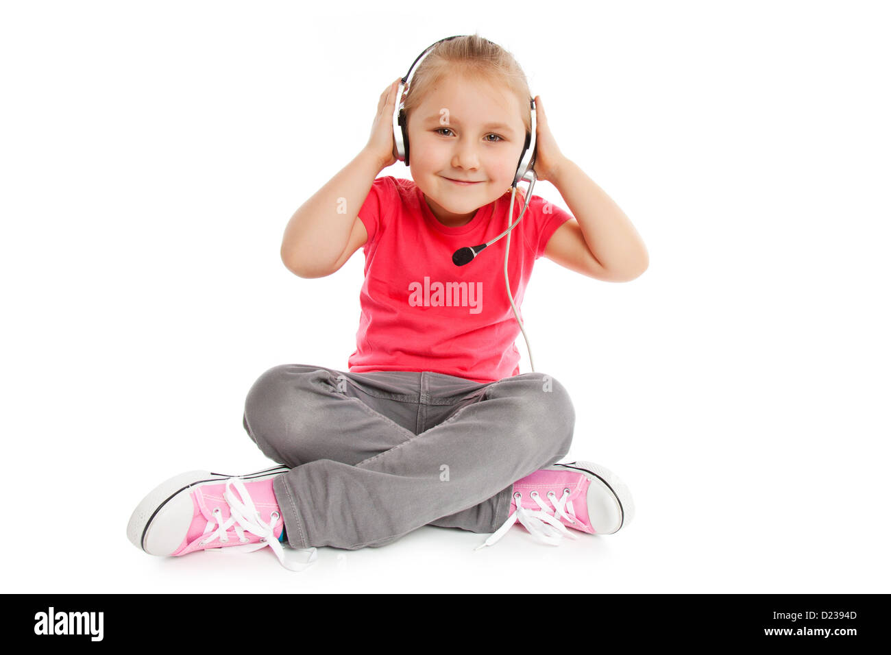 Little girl with headset. Studio shot Stock Photo - Alamy