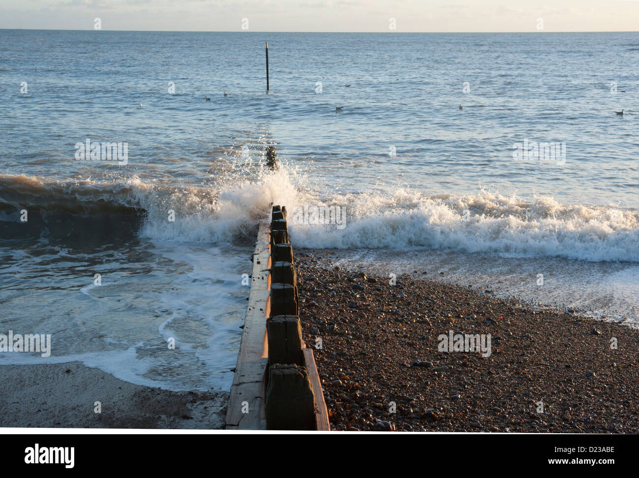 Wooden groynes on a beach in Rustington, West Sussex, UK Stock Photo ...