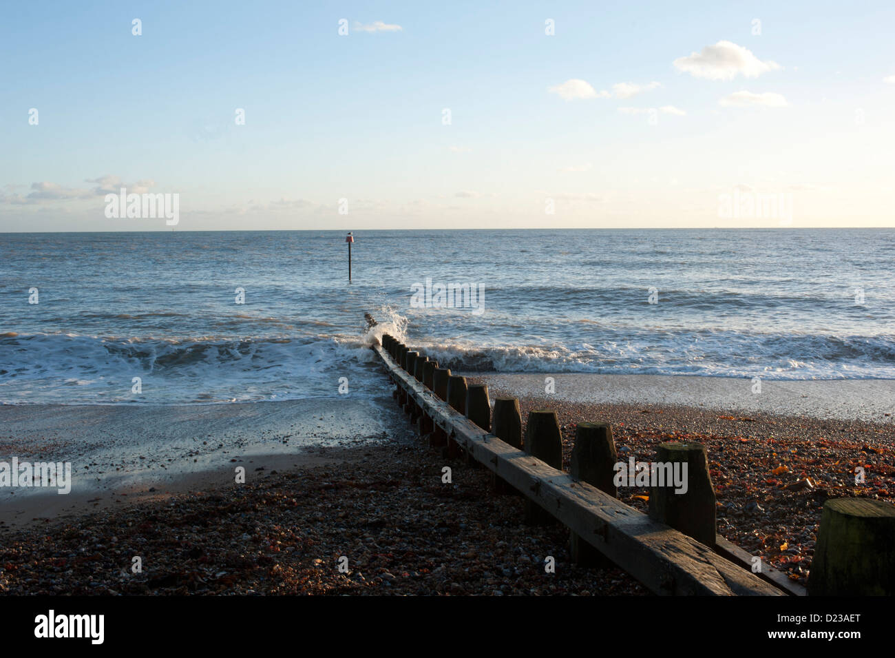 Wooden groynes on a beach in Rustington, West Sussex, UK Stock Photo ...