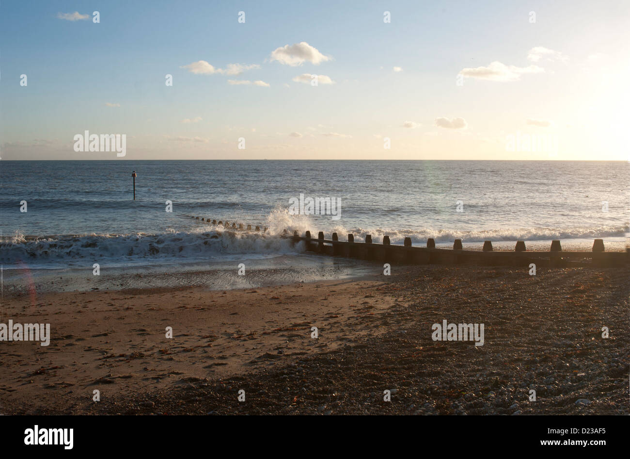 Wooden groynes on a beach in Rustington, West Sussex, UK Stock Photo ...