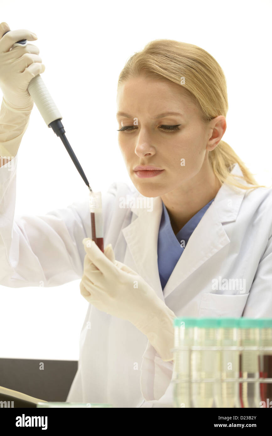 Medical researcher examining sample with glove on Stock Photo - Alamy
