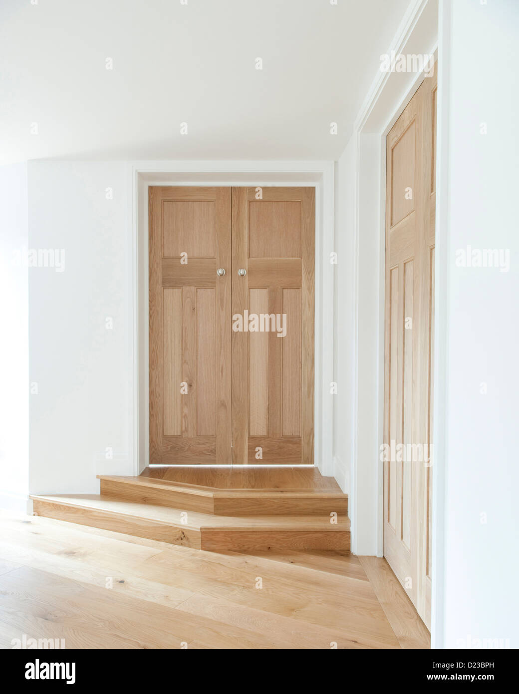 Wooden doors and steps inside a house Stock Photo - Alamy