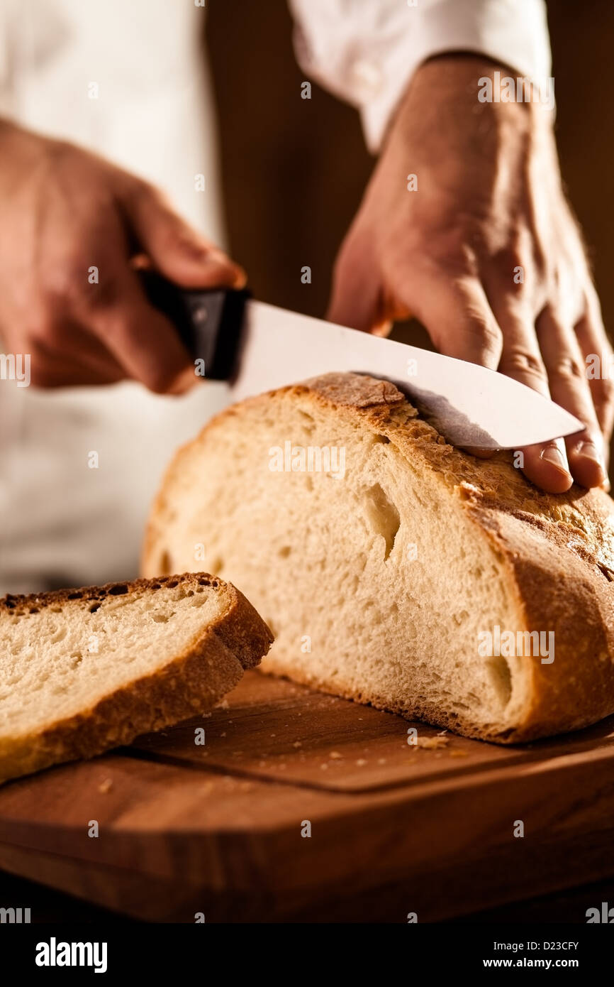 Hands caucasian man cutting bread hi-res stock photography and images ...