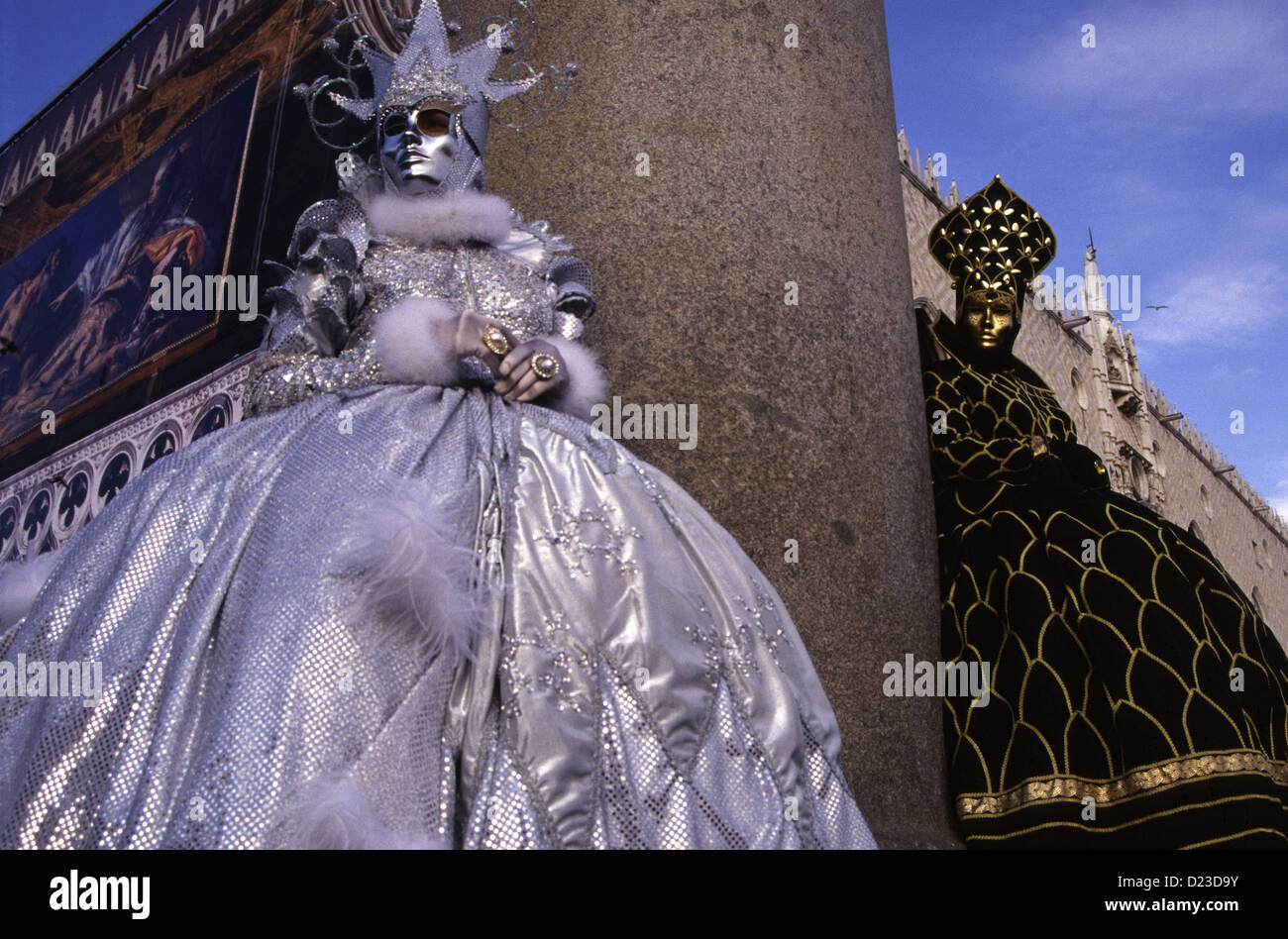 People wearing lavish costumes during the Carnival of Venice Carnevale ...