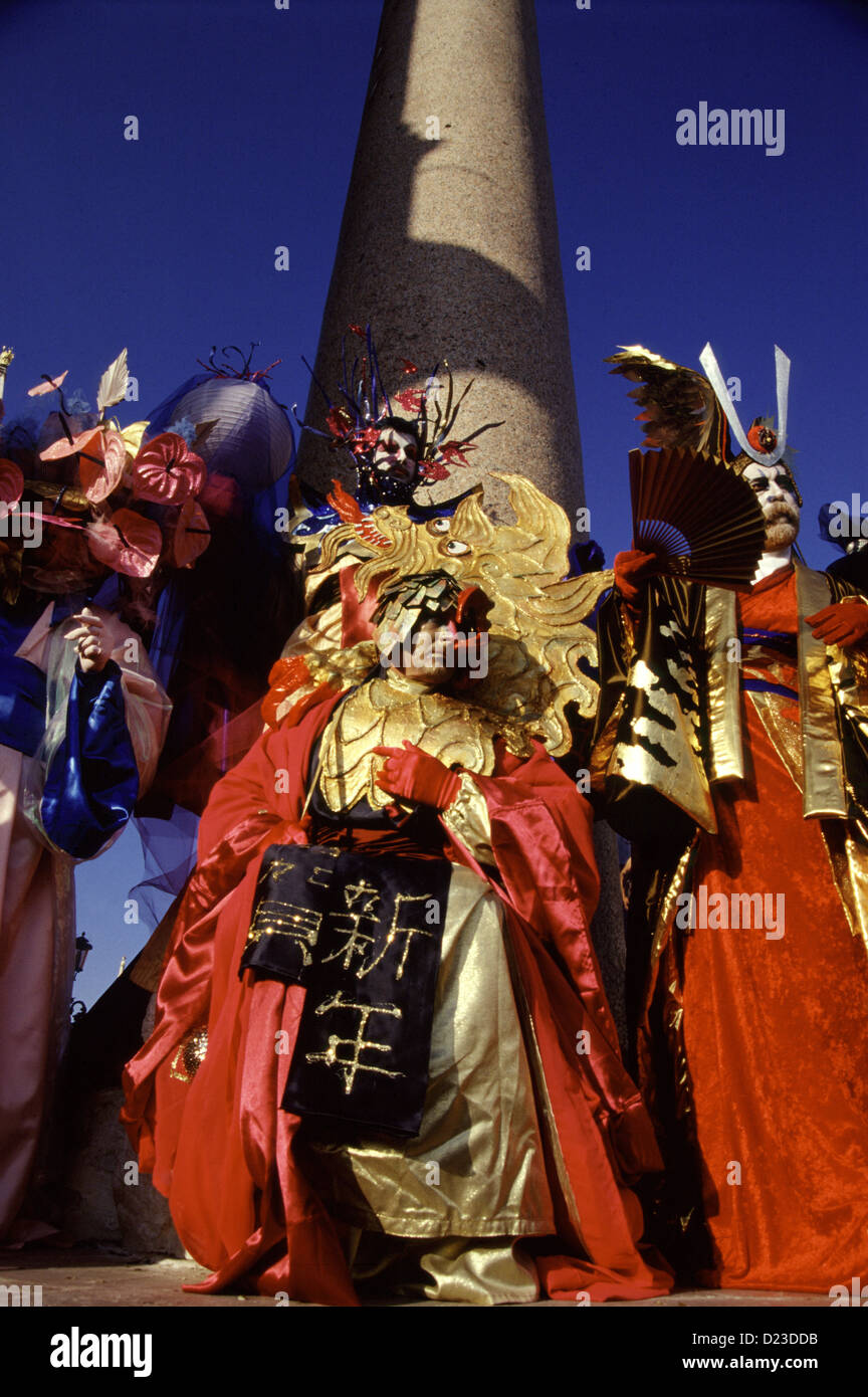 People wearing lavish costumes during the Carnival of Venice Carnevale ...