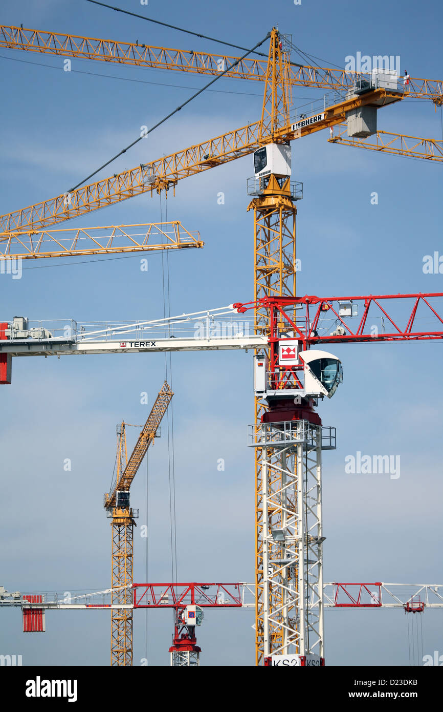 Berlin, Germany, Construction cranes against blue sky Stock Photo - Alamy