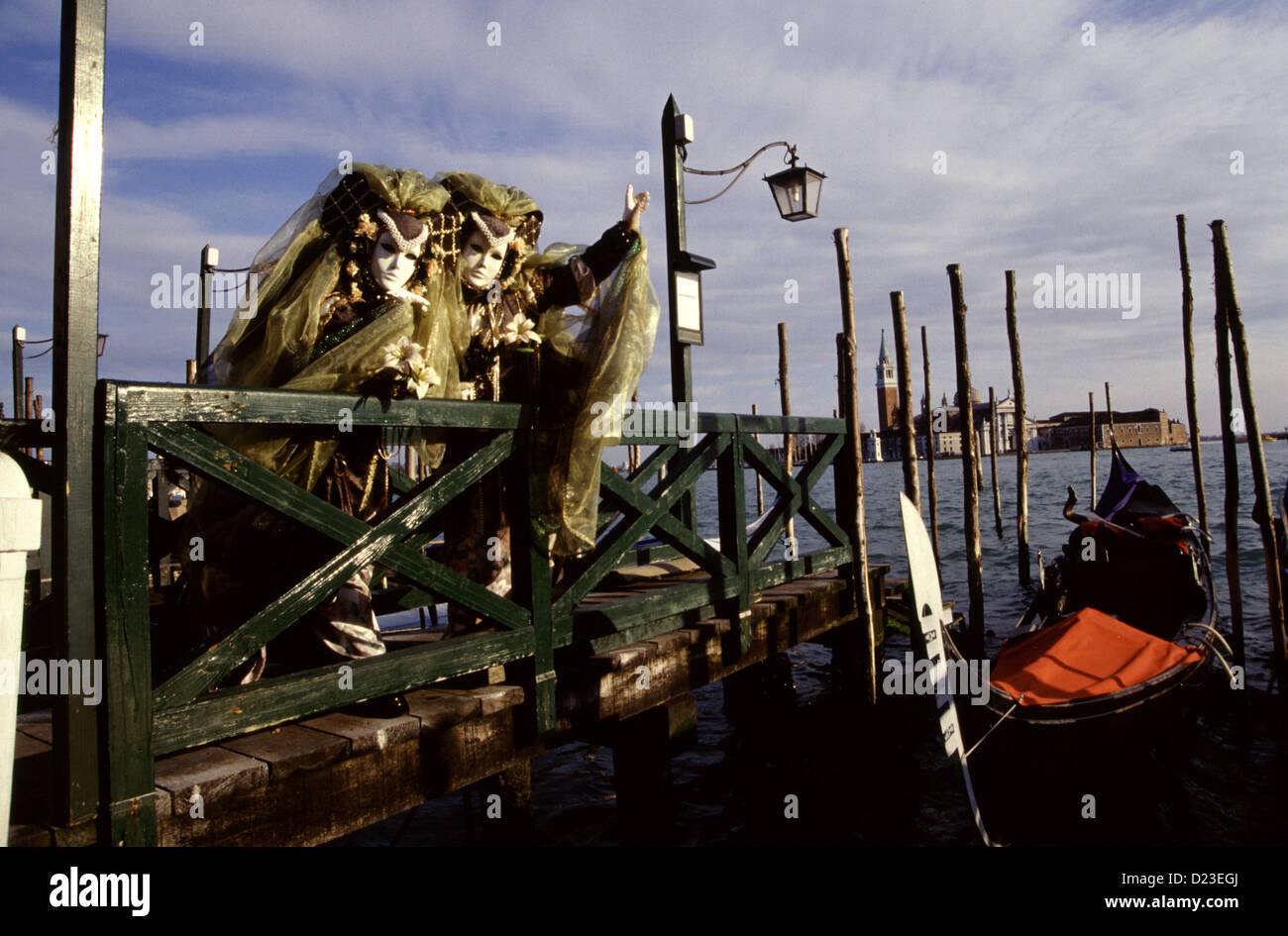 People wearing lavish costumes during the Carnival of Venice Carnevale ...