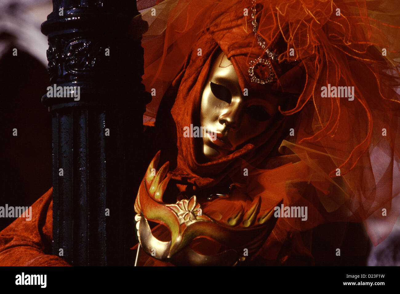 A person wearing a gilded Volto or Larva mask during the Carnival of ...