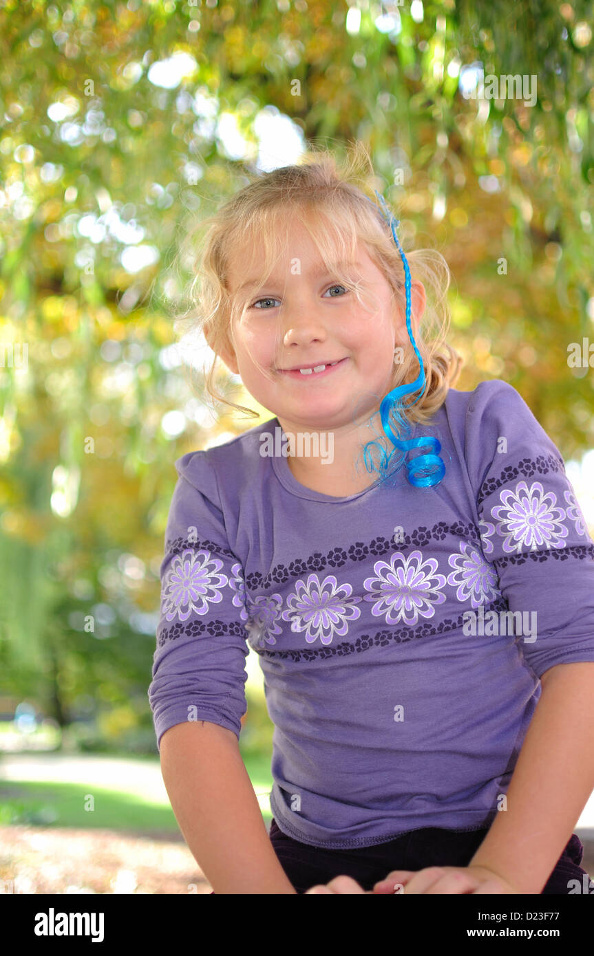 Litle girl playing in autumn park, Happy child Stock Photo - Alamy