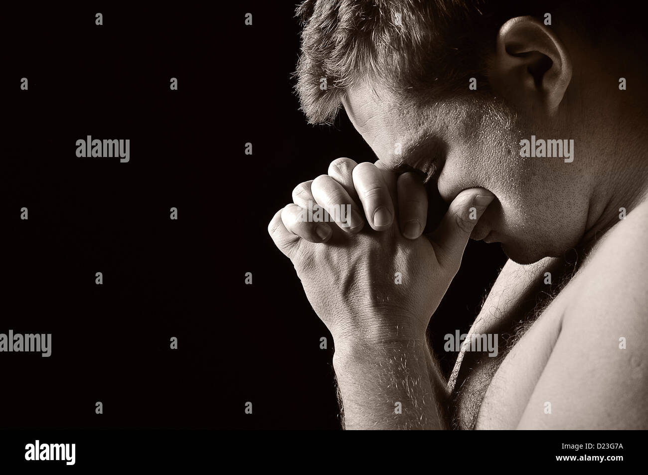 Man praying black and white hi-res stock photography and images - Alamy