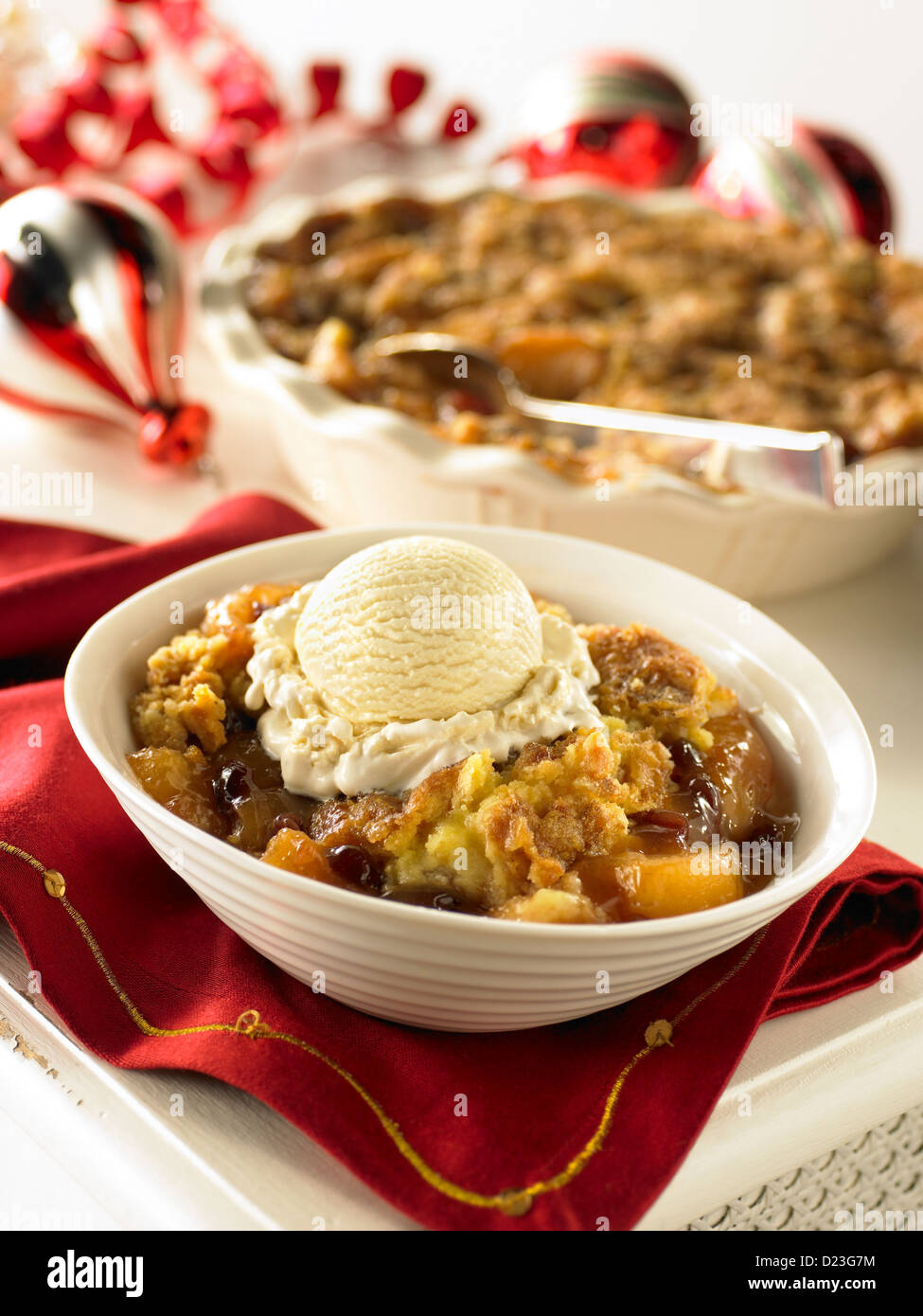 Mixed fruit cobbler in a holiday setting Stock Photo - Alamy