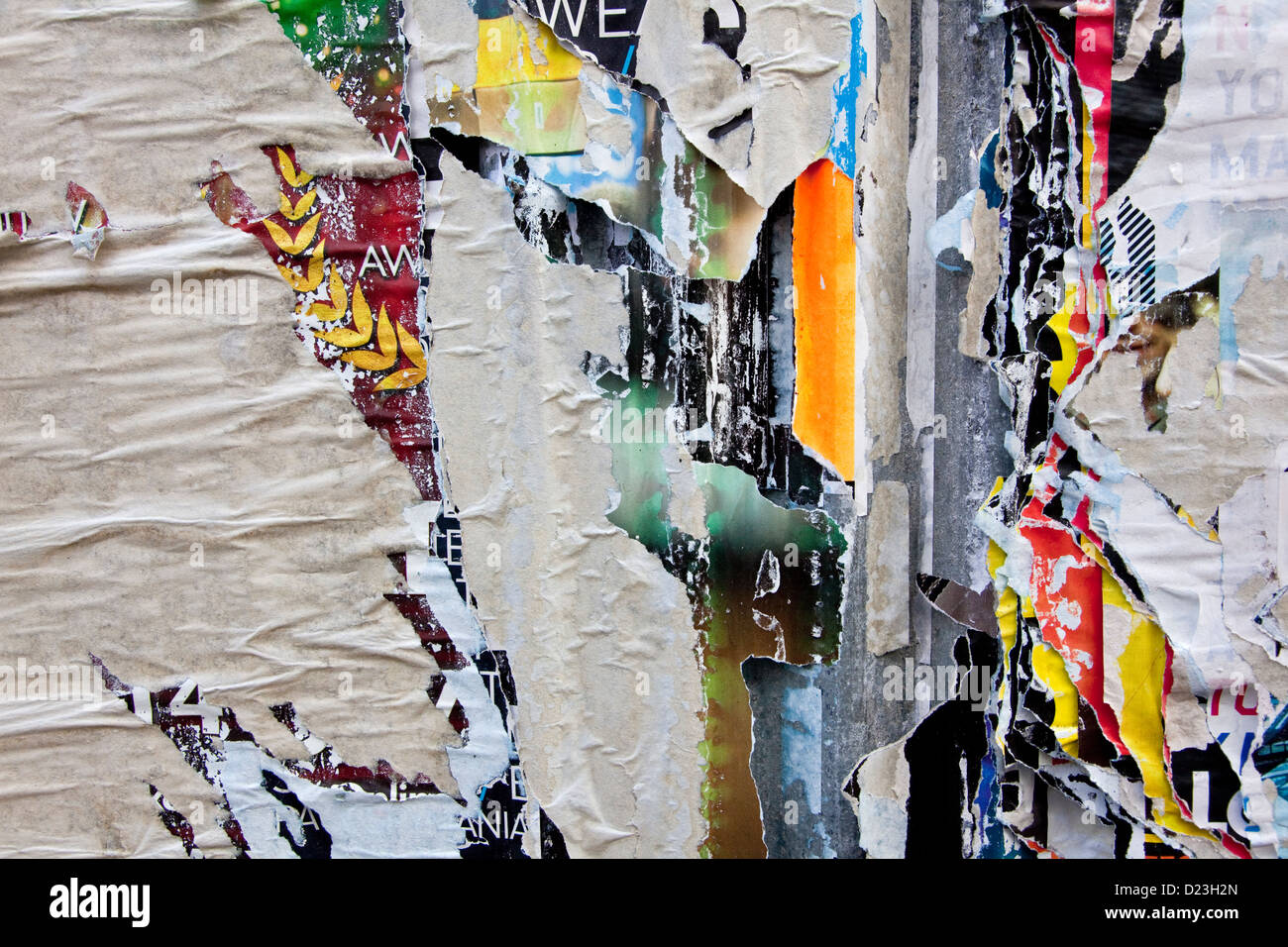 Torn layers of paper fly posters Stock Photo - Alamy