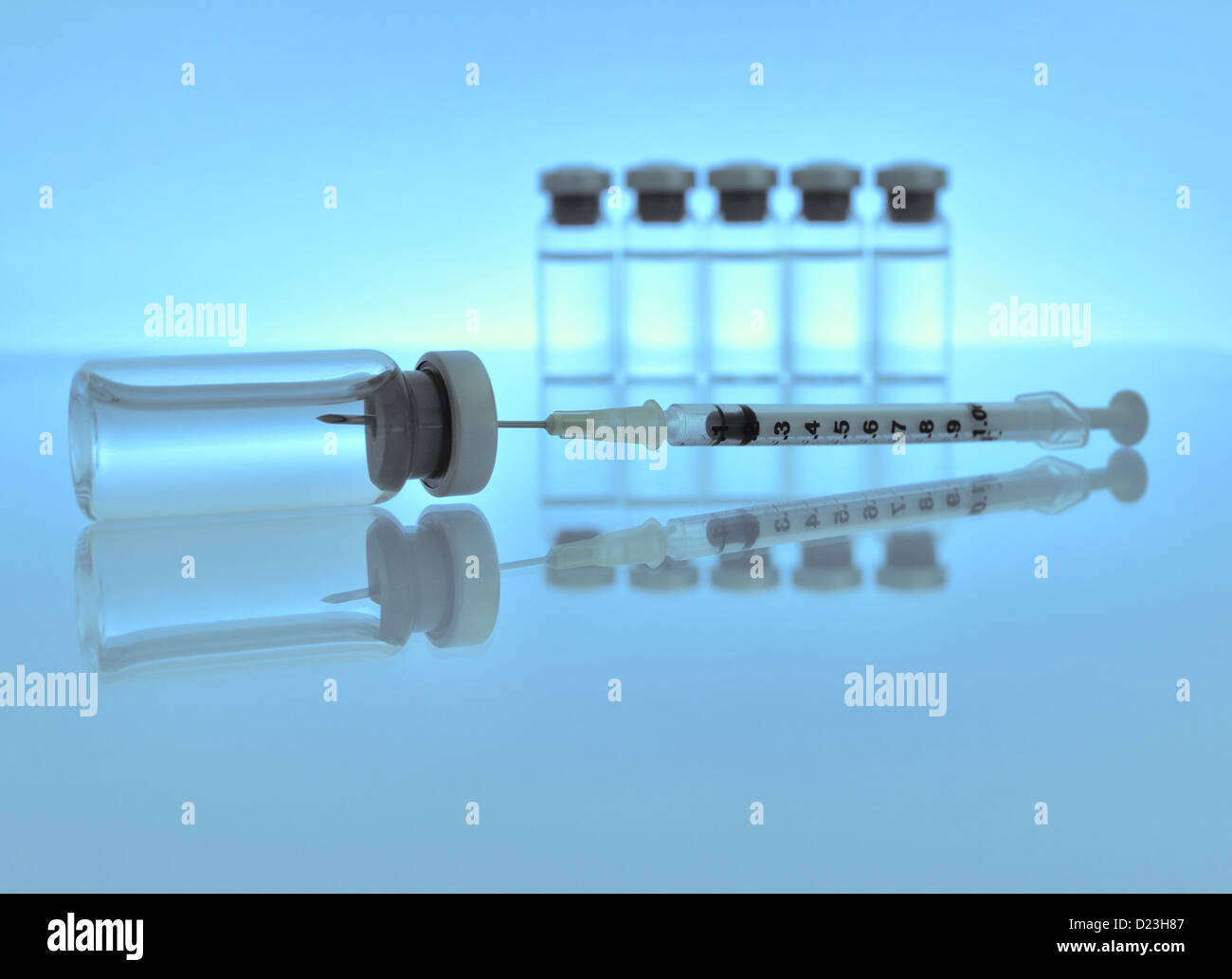 Vials of medications with syringe and needle Stock Photo - Alamy