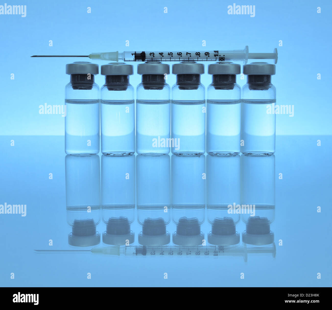 Vials of medications with syringe and needle Stock Photo - Alamy