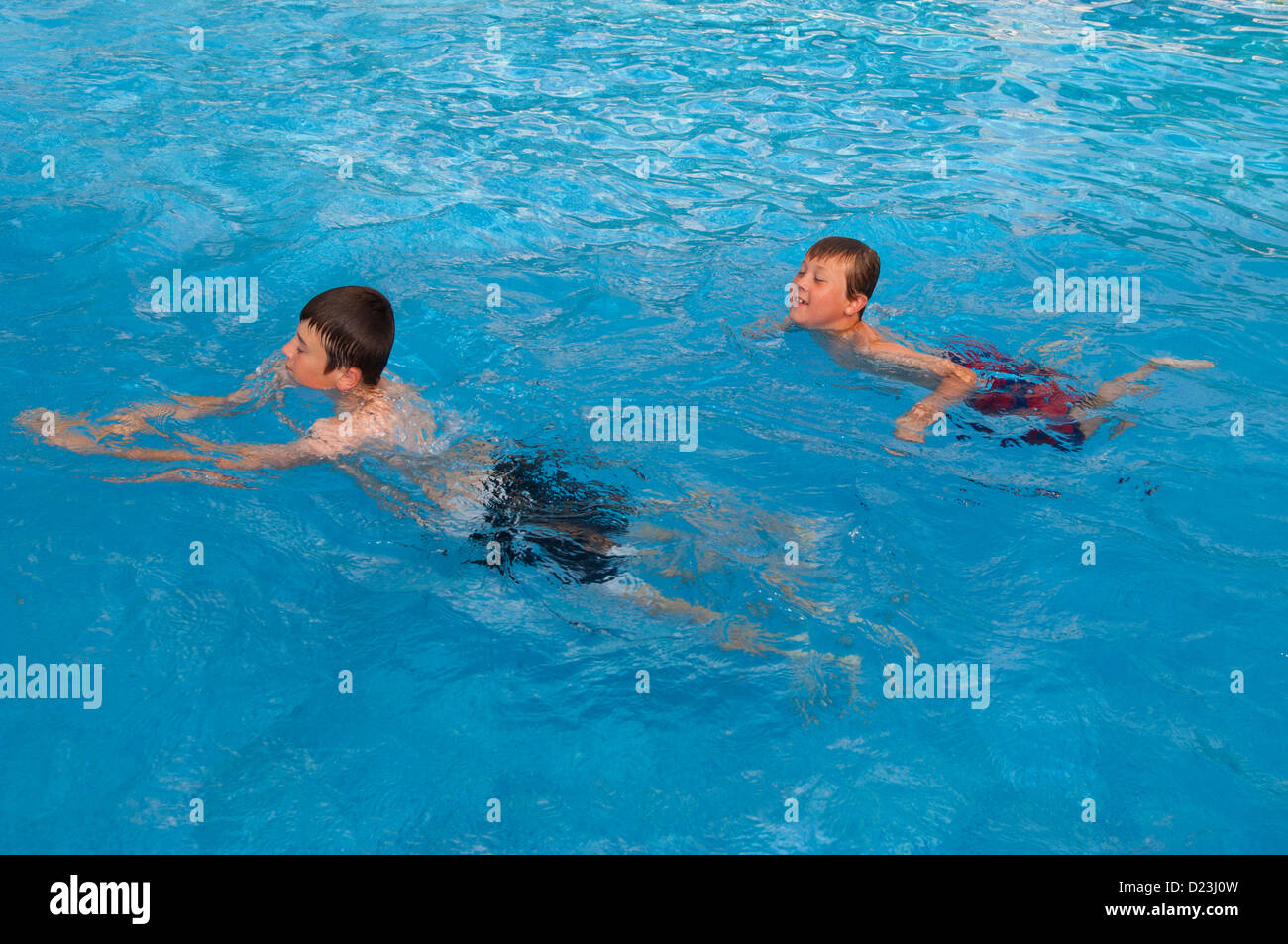 Brothers having fun with splashing water hi-res stock photography and ...