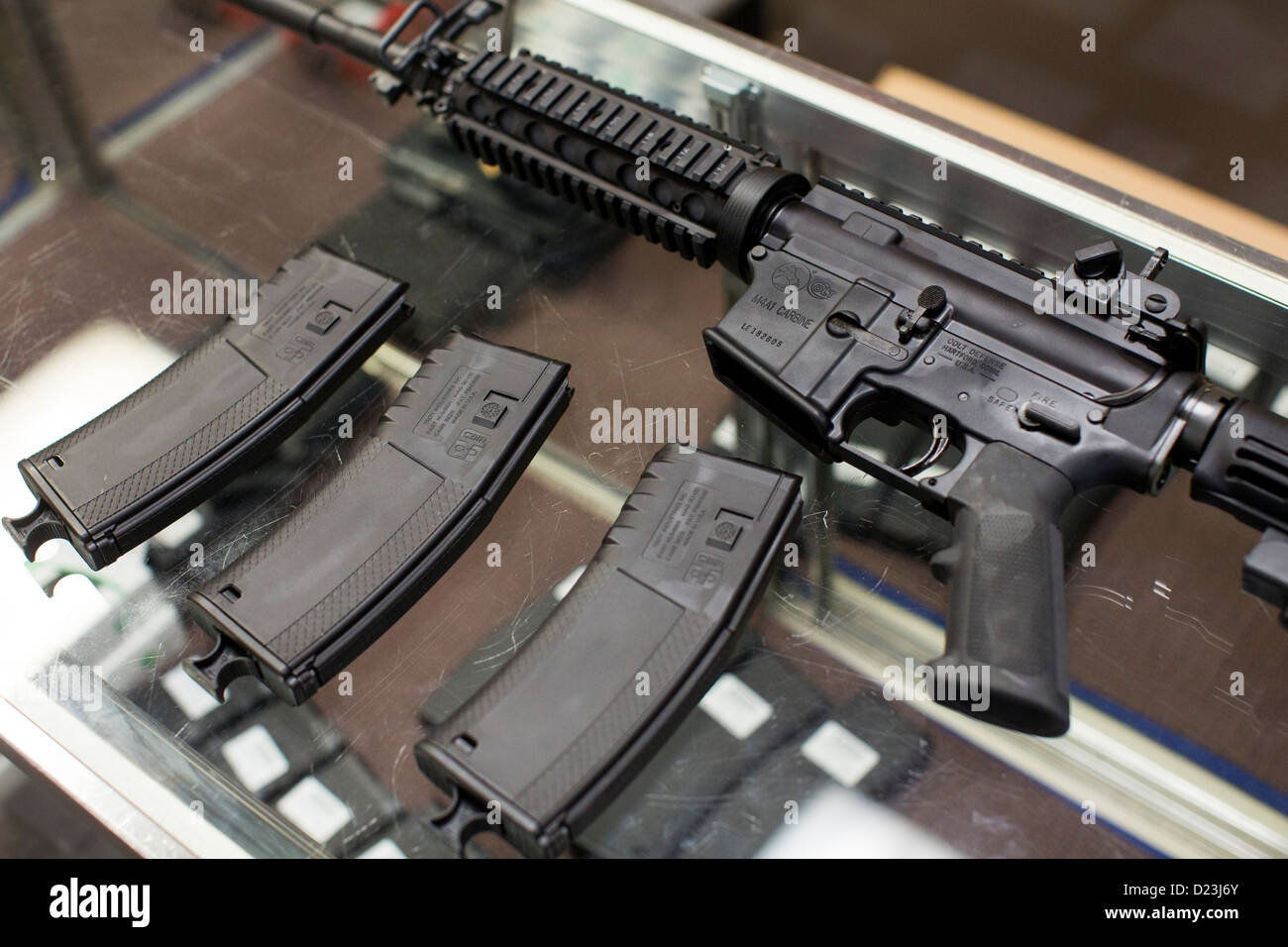 A Colt Defense M4A1 Carbine assault rifle on display at a gun shop with ...