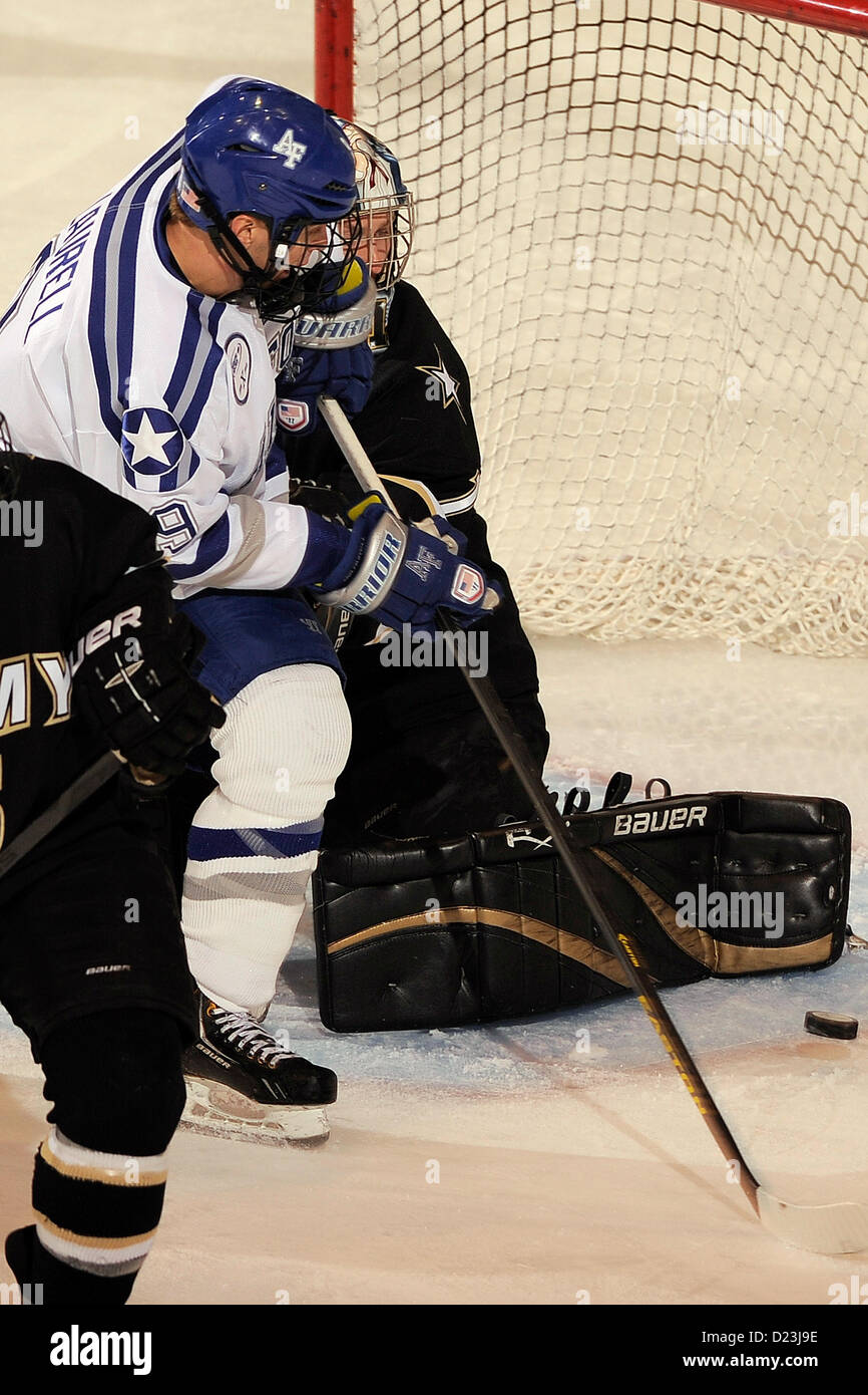 Falcon senior Kyle De Laurell scores against Army goalie Rob Tadazak ...