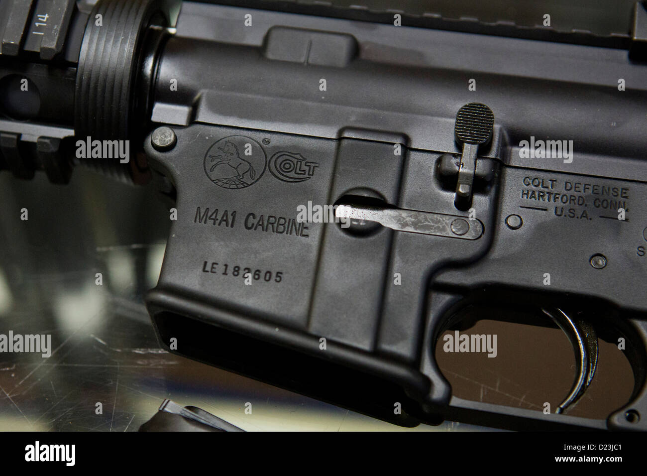 A Colt Defense M4A1 Carbine assault rifle on display at a gun shop with ...