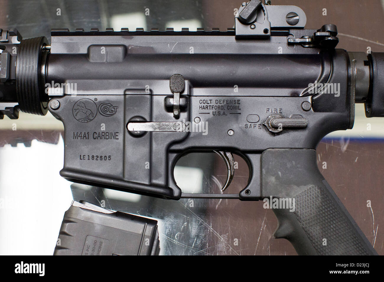 A Colt Defense M4A1 Carbine assault rifle on display at a gun shop with ...