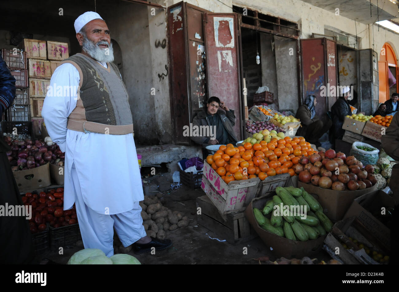 An Afghan man displays his produce at a market in Farah City, as the ...