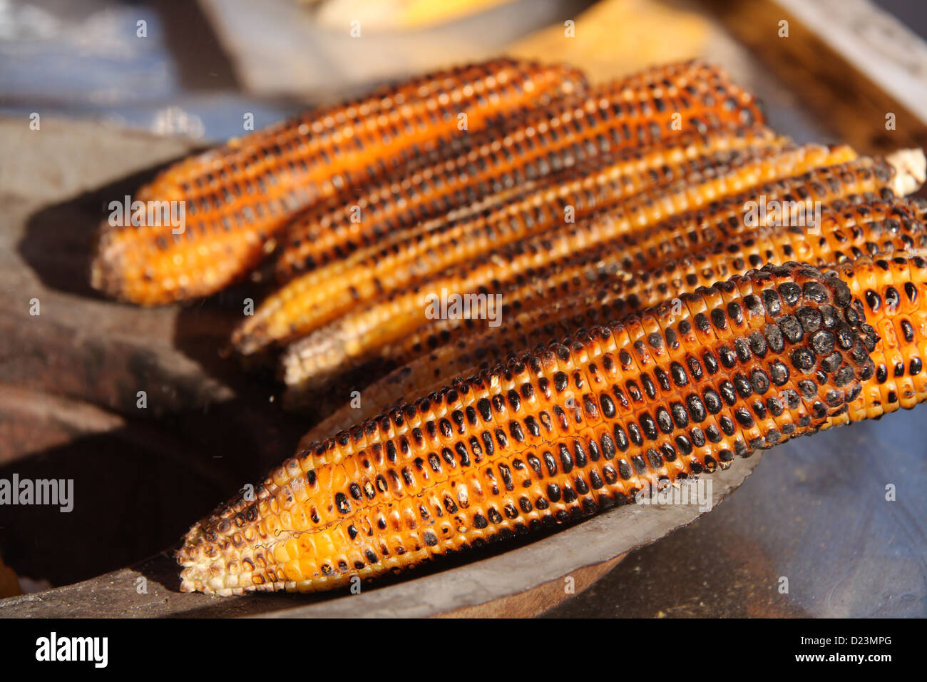 barbequed corn with black spots on it Stock Photo - Alamy