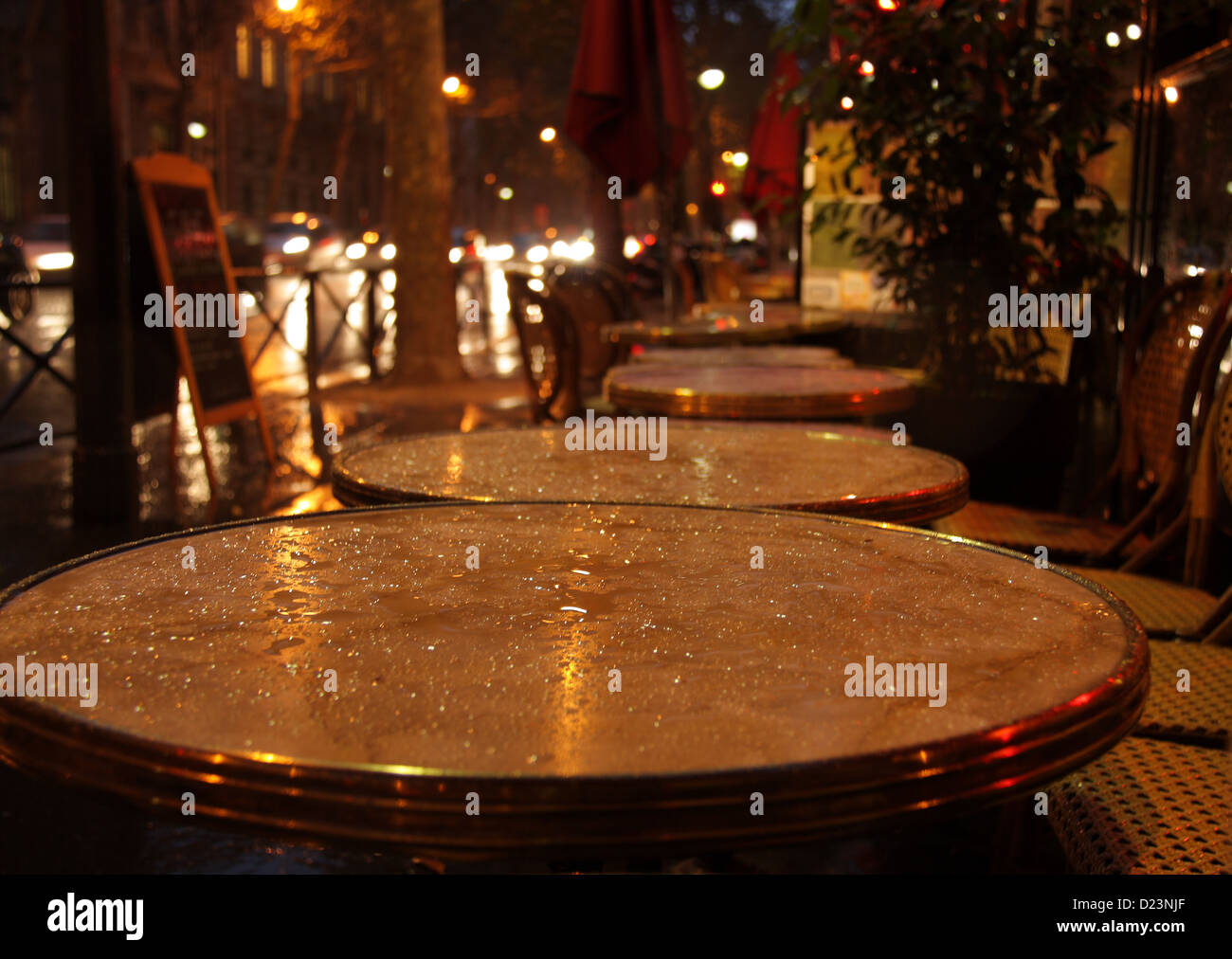 cafe in paris at evening, tables are wet after rain Stock Photo - Alamy