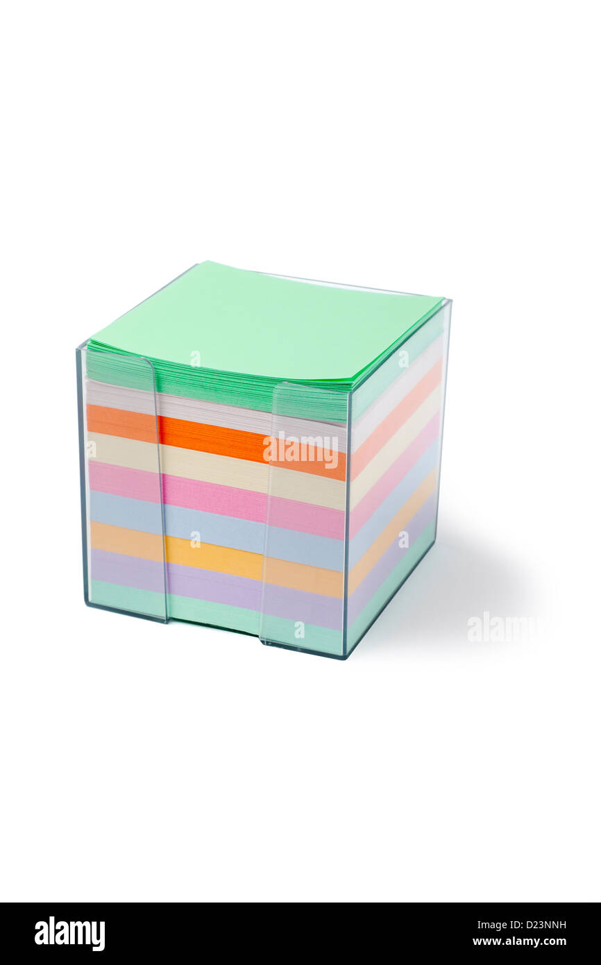 Container with note papers in different colors on white background ...