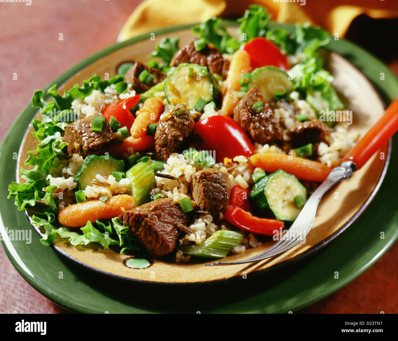 Emu meat in a stir-fry salad Stock Photo - Alamy