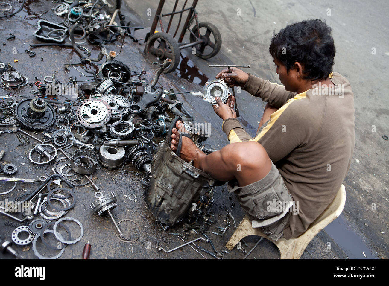 Side street mechanic working with engine parts in the Philippines Stock ...