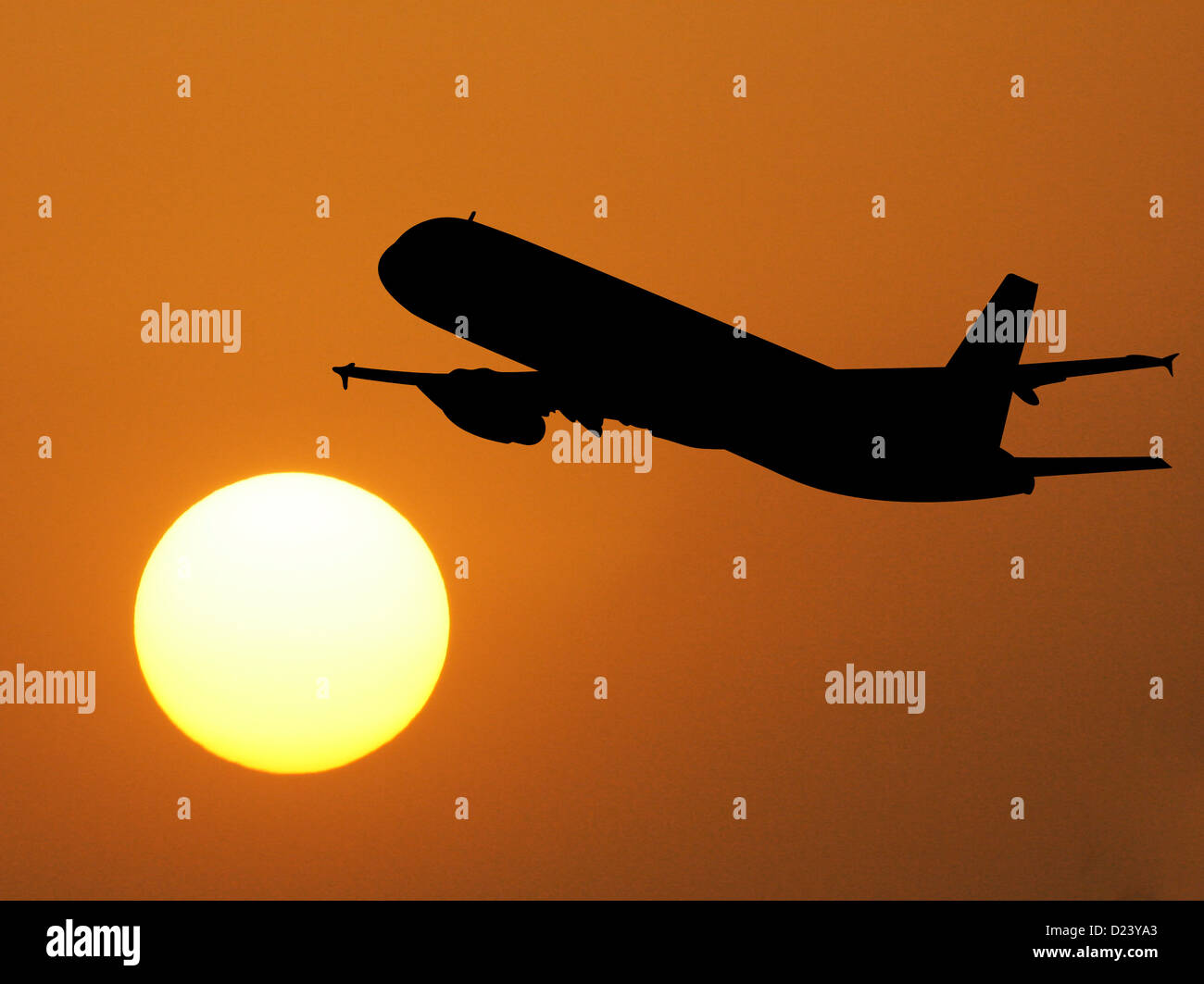 Plane taking off into the sunset Stock Photo - Alamy