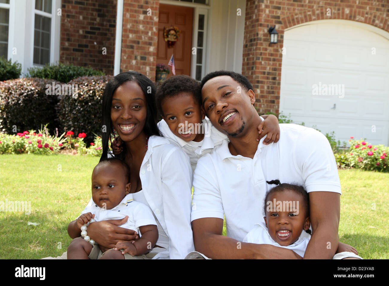 African American family together outside their home Stock Photo - Alamy