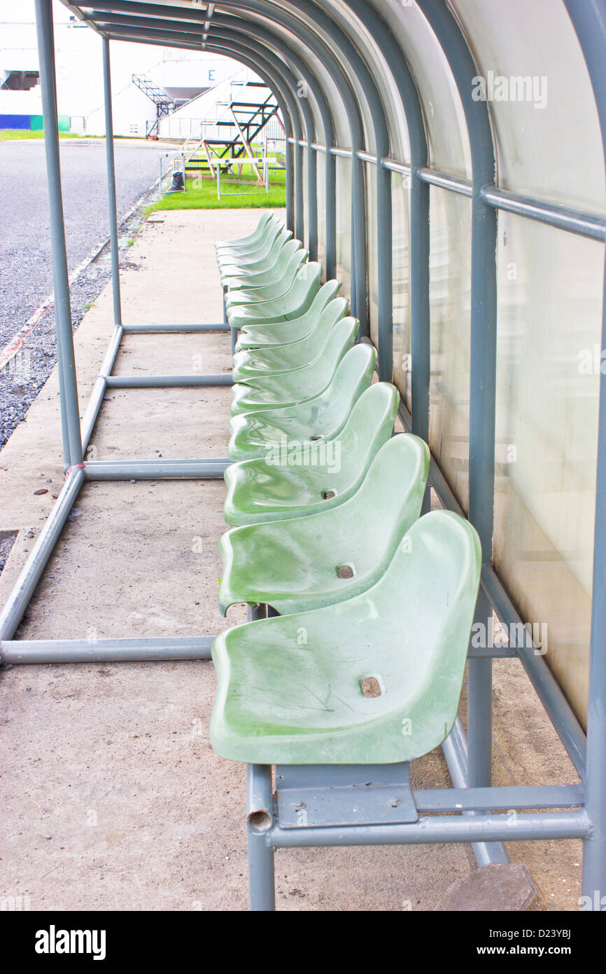 Coach and reserve benches in football stadium Stock Photo - Alamy