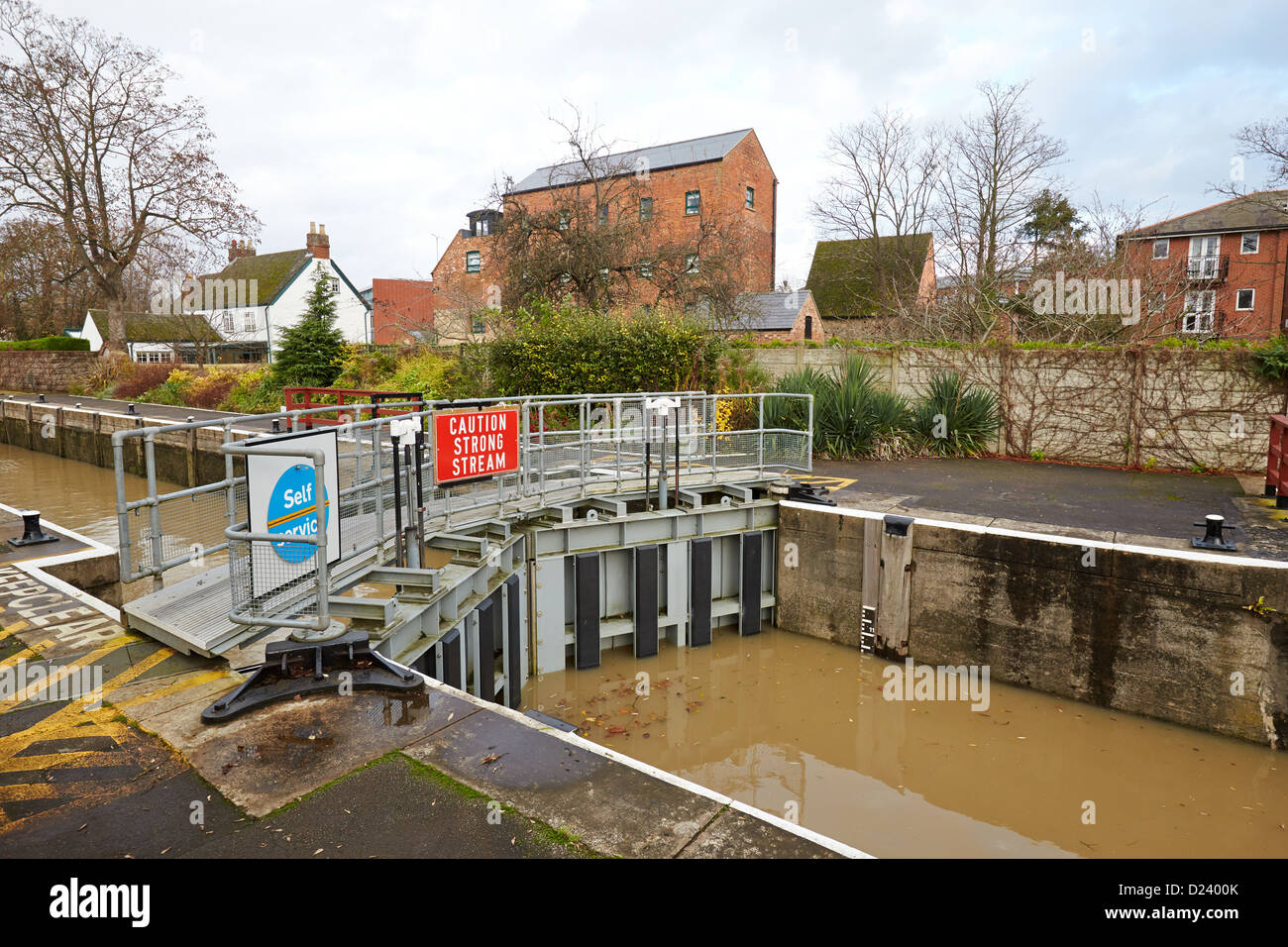 Osney Lock on the River Thames with a strong current warning during ...