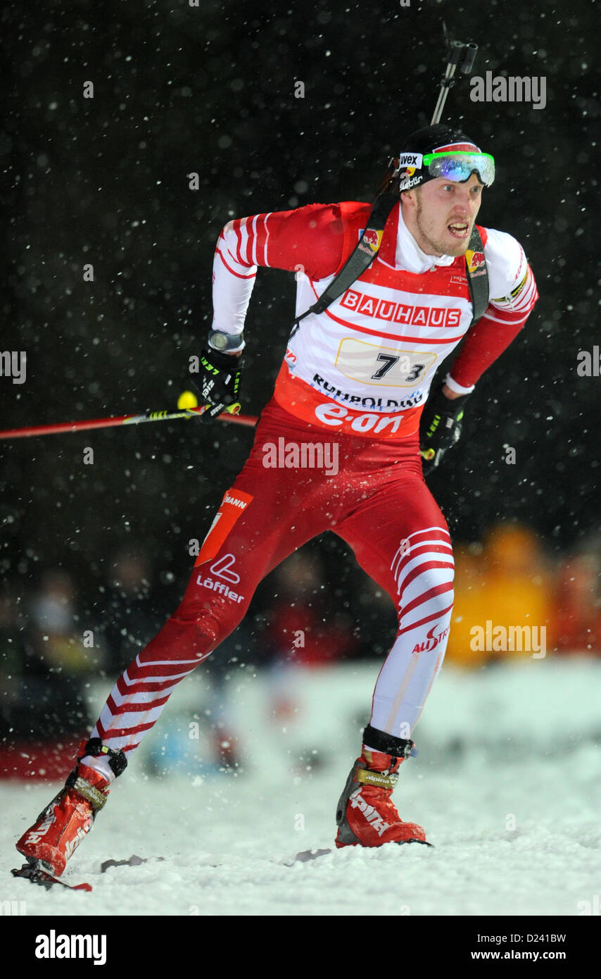 Austrian biathletes Dominik Landertinger in action during the 4 x 7.5 ...