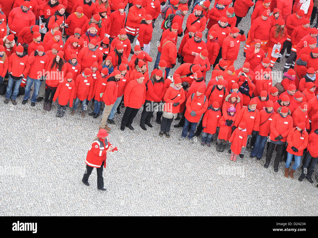 1,800 members of the German Red Cross (DRK) dressed in red form a large ...