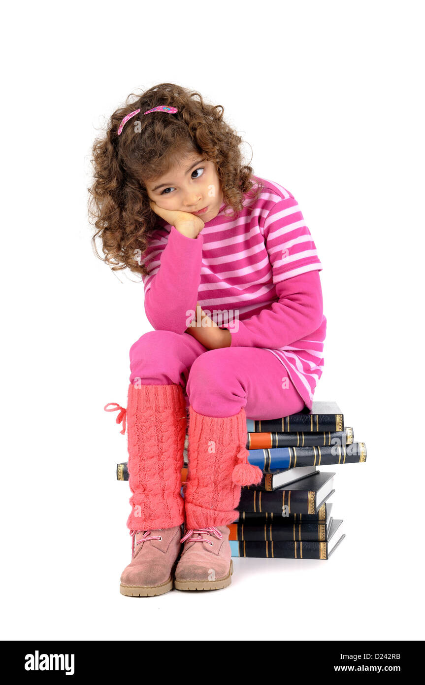 Young bored girl posing with books isolated in white Stock Photo - Alamy