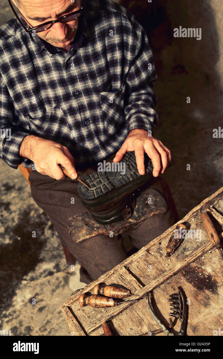 cobbler at work with old tools Stock Photo - Alamy