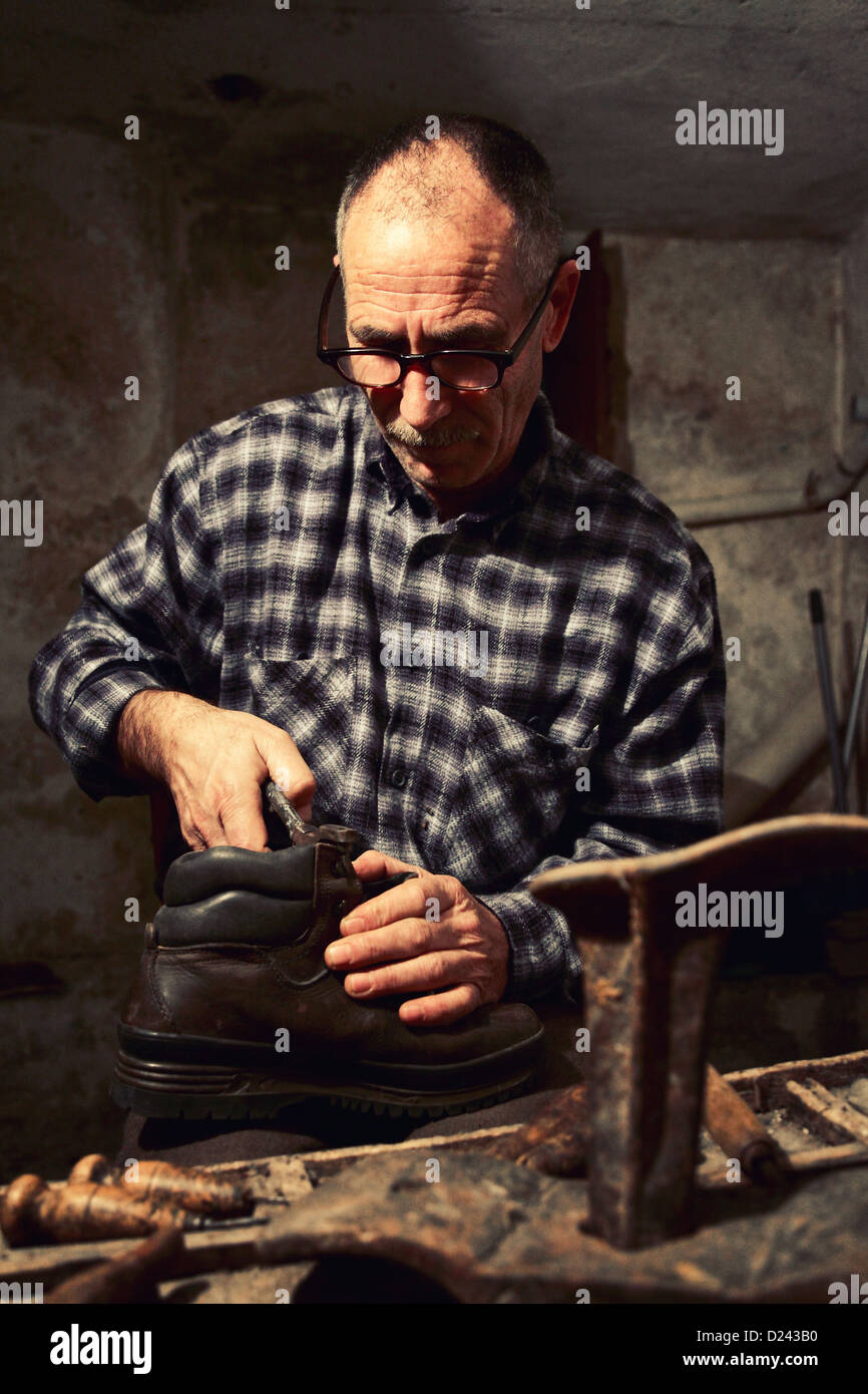 cobbler at work with old tools Stock Photo - Alamy