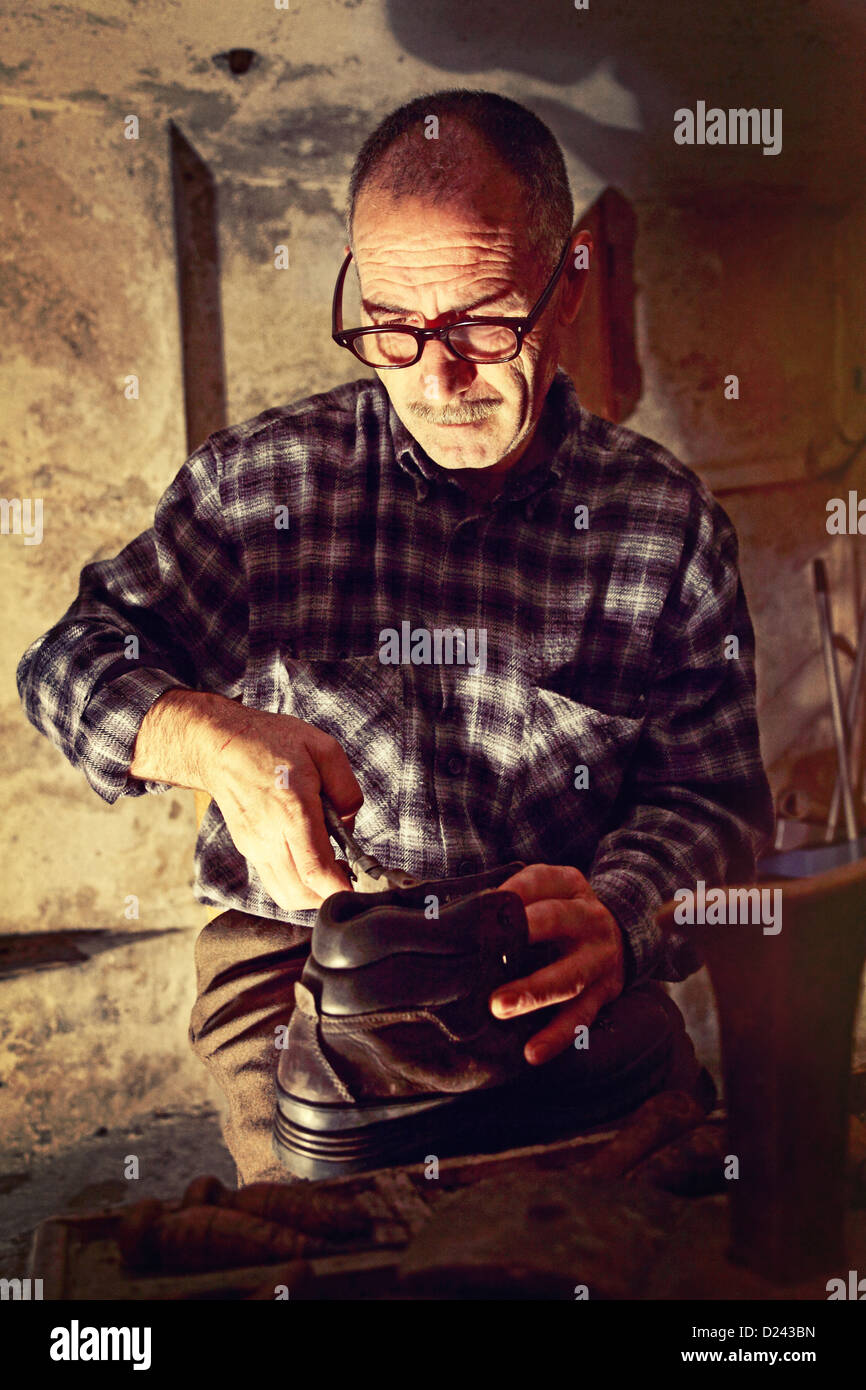 cobbler at work with old tools Stock Photo - Alamy