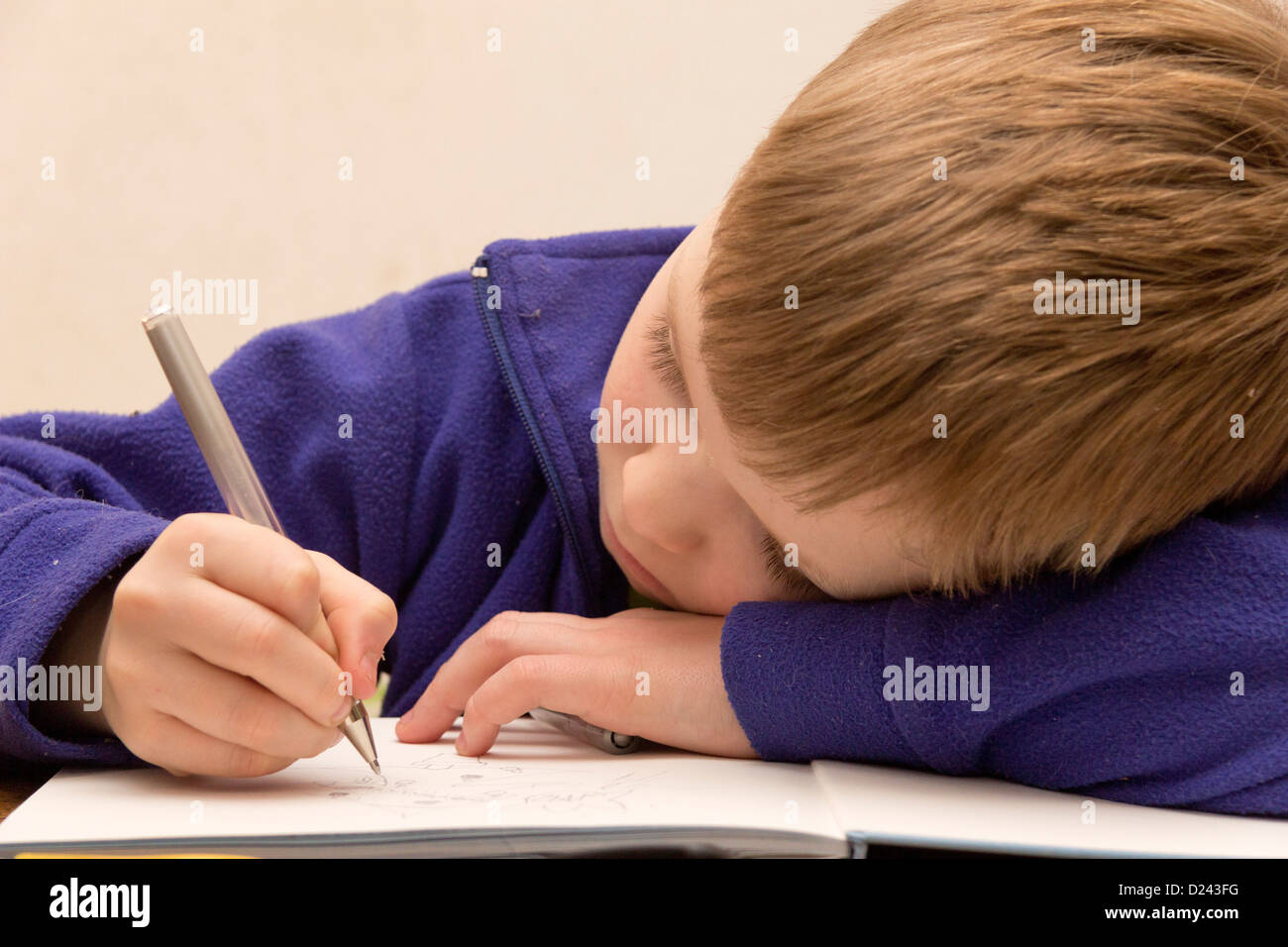 young boy writing Stock Photo - Alamy