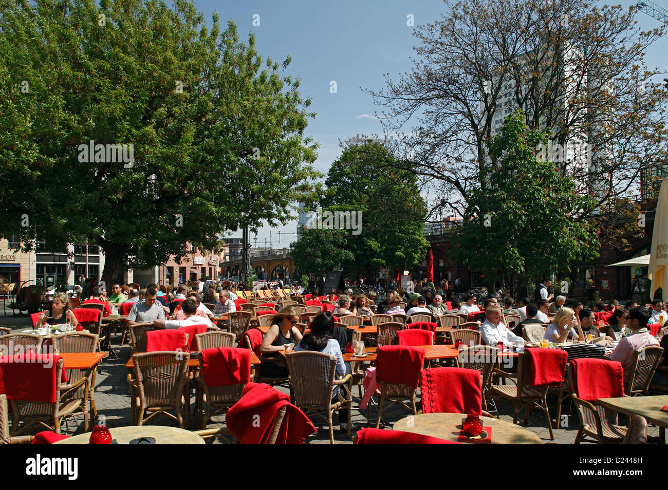 Berlin, Germany, guests are seated in the outdoor cafes at Hackescher ...