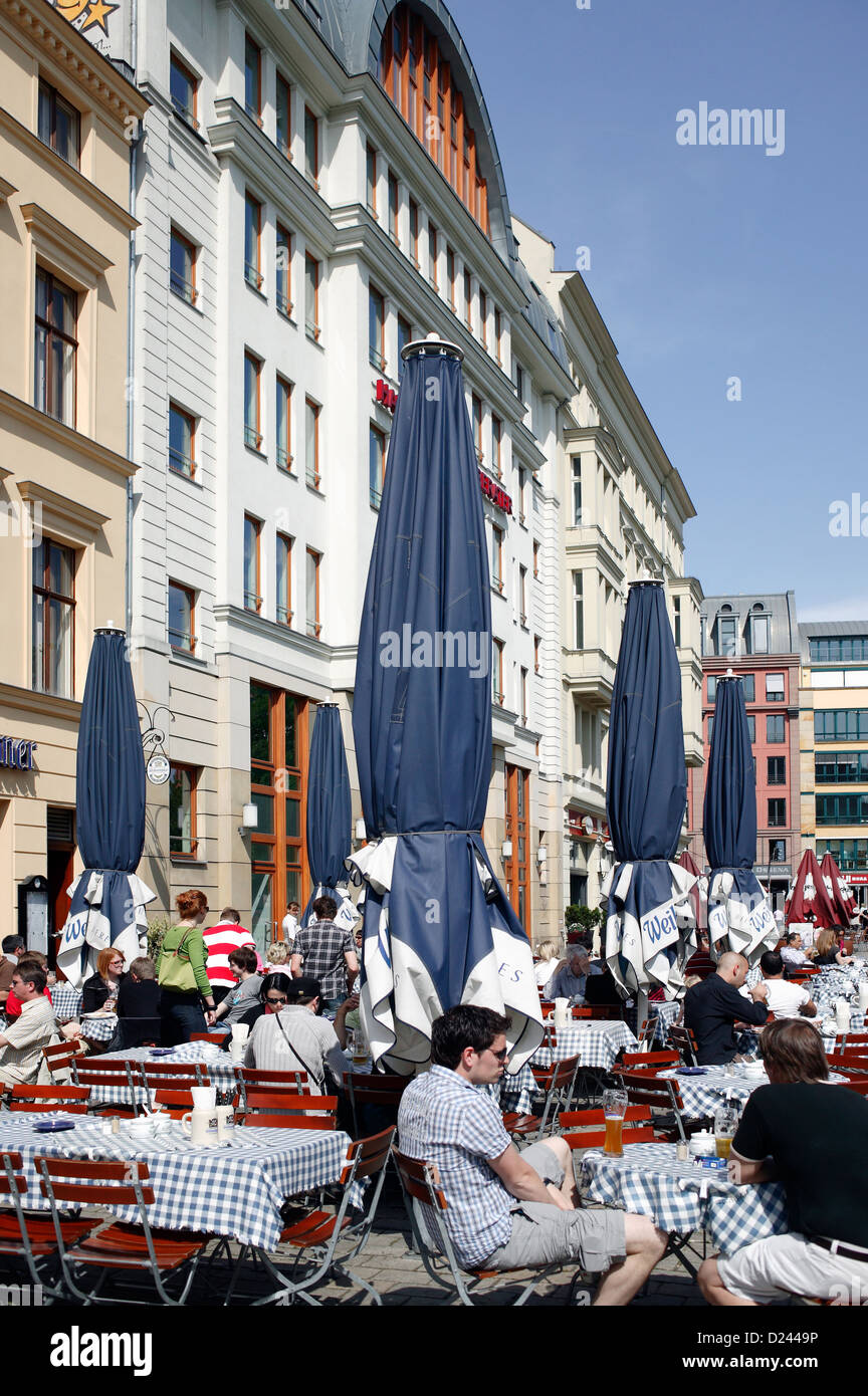 Berlin, Germany, guests are seated in the outdoor cafes at Hackescher ...