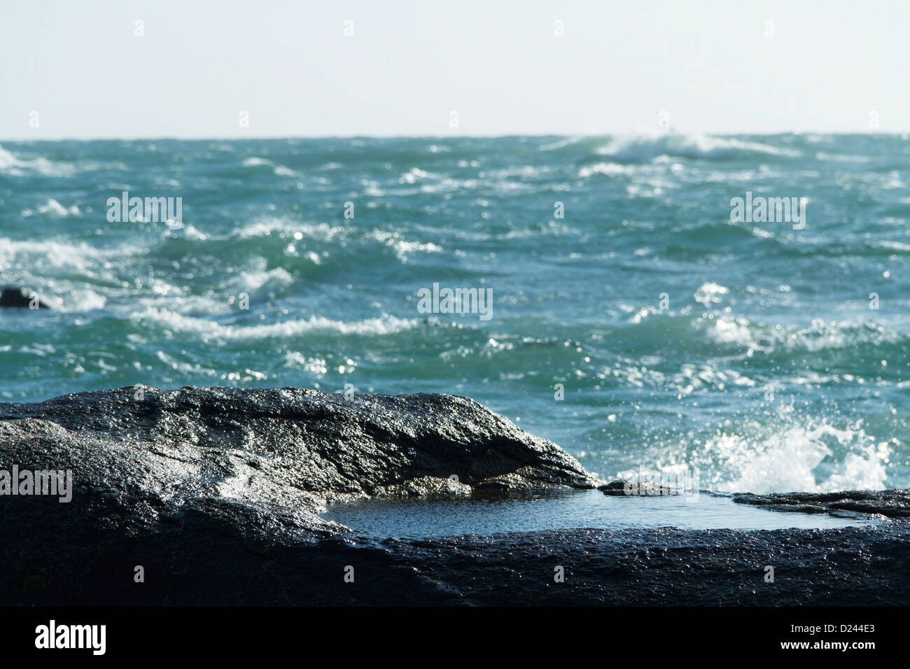 Sea with rocks Stock Photo - Alamy