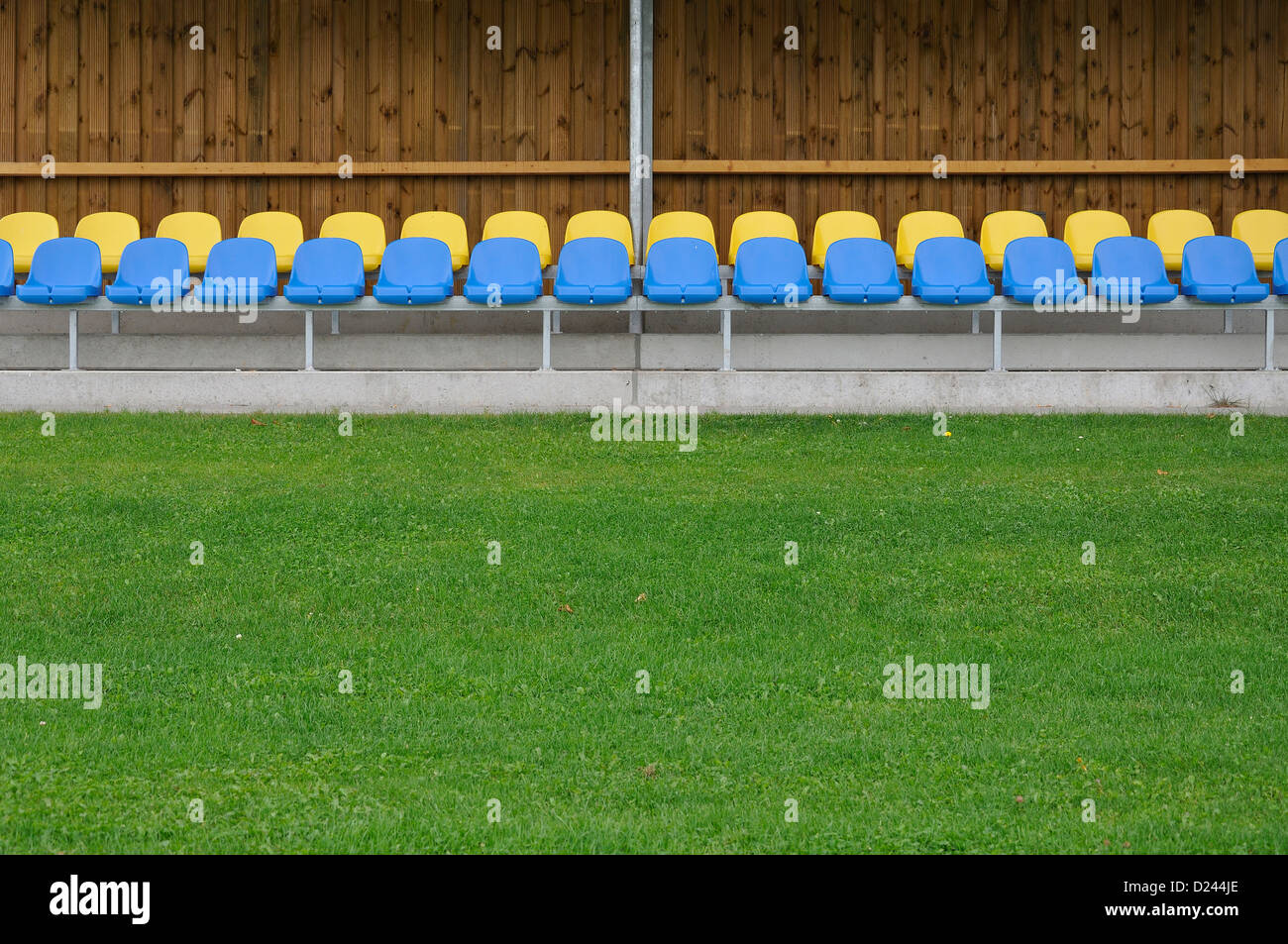 Germany, Bavaria, Munich, Stand with blue and yellow plastic seats ...