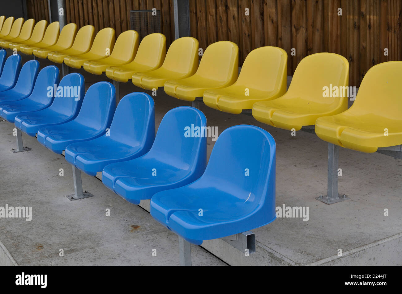 Germany, Bavaria, Munich, Stand with blue and yellow plastic seats ...