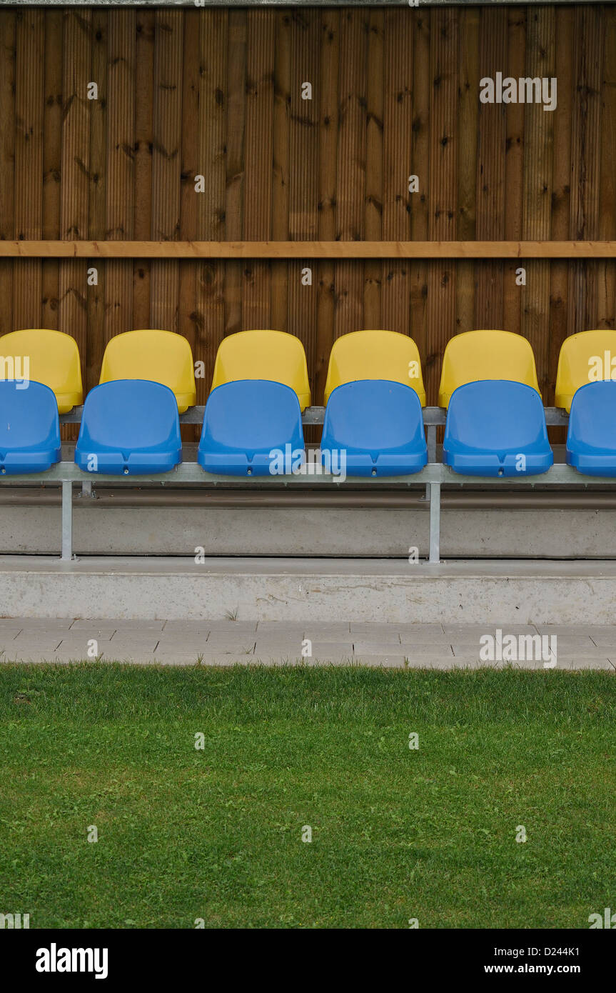 Germany, Bavaria, Munich, Stand with blue and yellow plastic seats ...